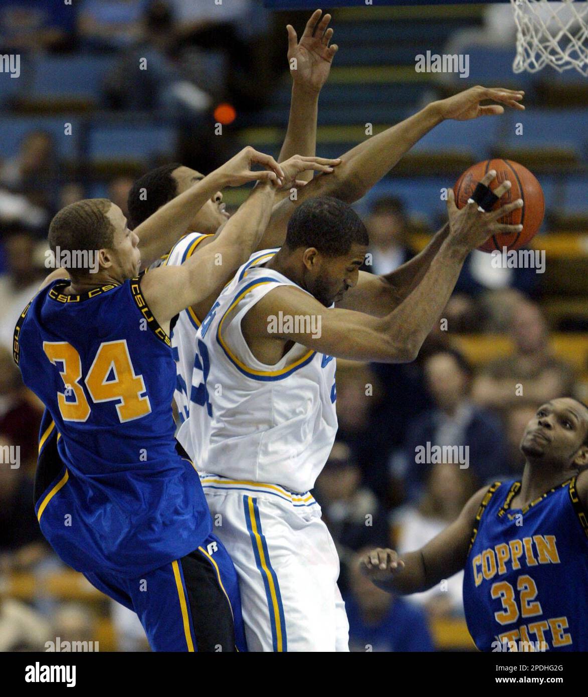 UCLA's Cedric Bozeman, right, rebounds against Coppin State's Brian Chesnut (34) as Darryl ...