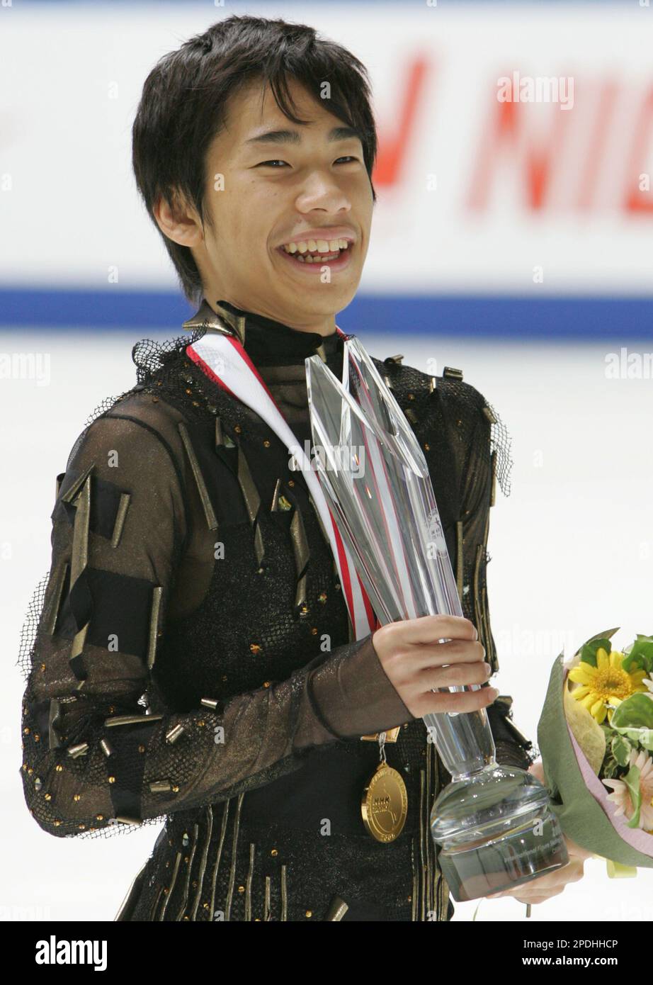 Nobunari Oda of Japan smiles during the awarding ceremony of Men's ...