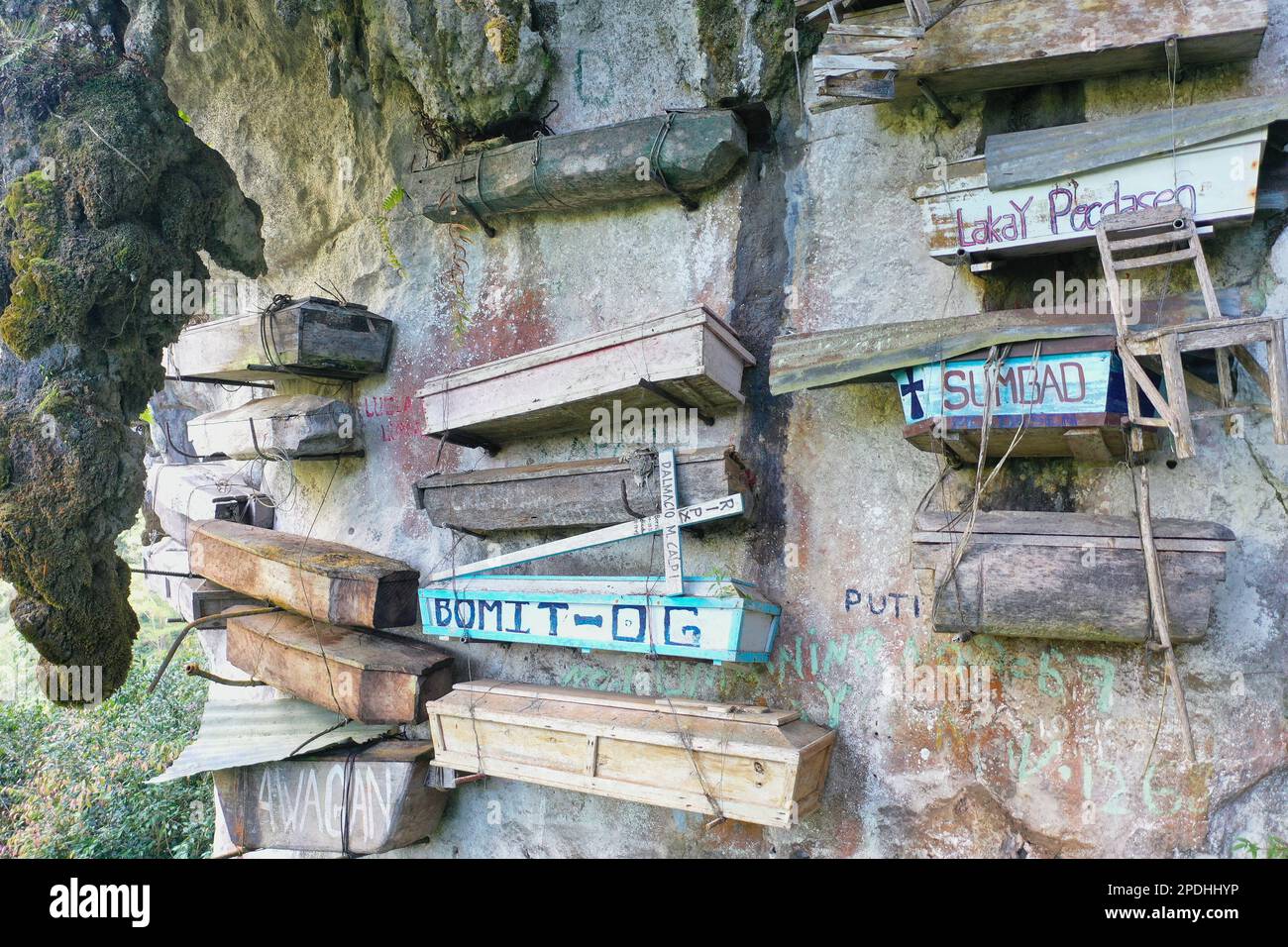Close-up of the hanging coffins of Sagada on an imposing white rock ...