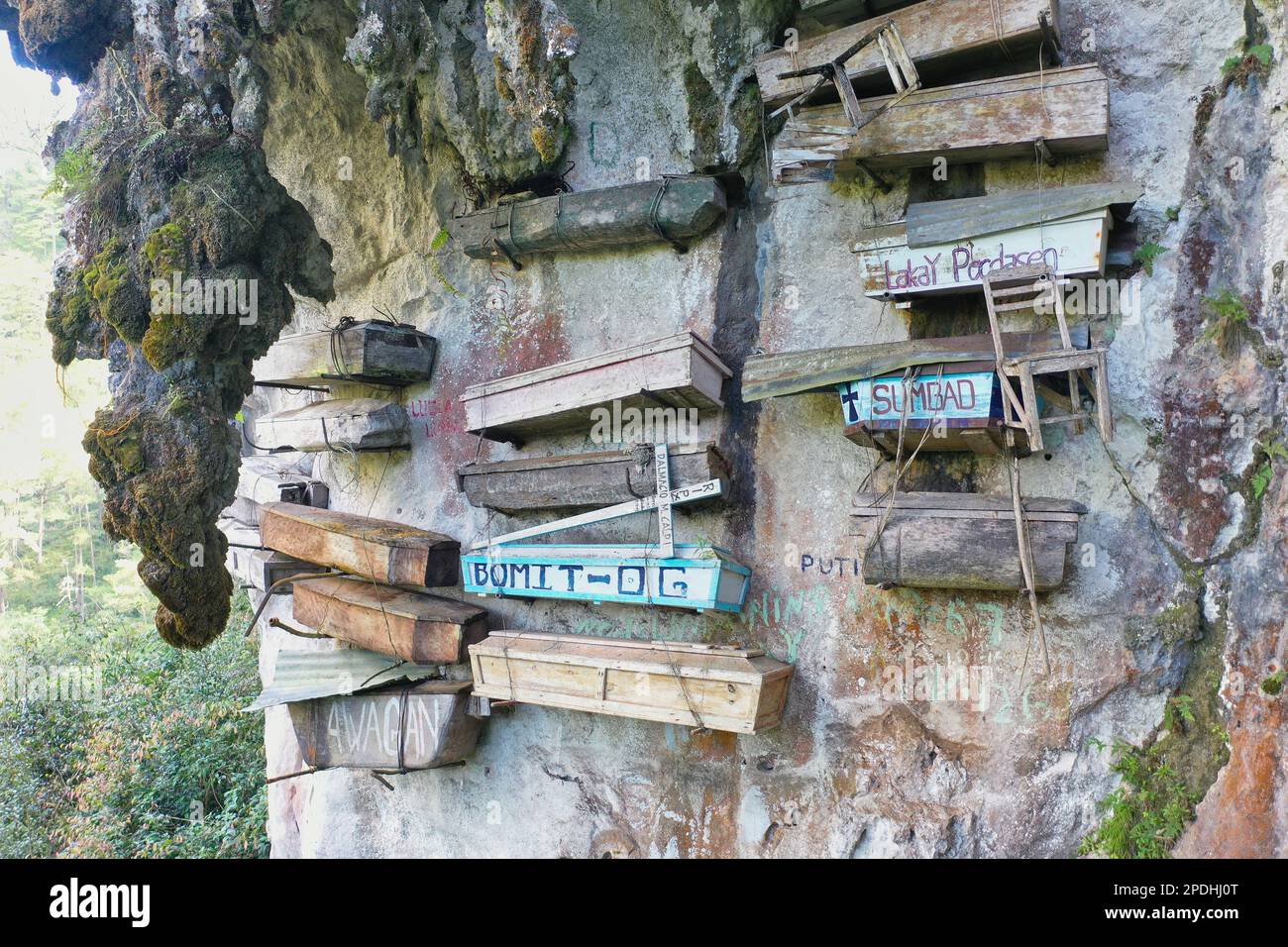 Close-up of the hanging coffins of Sagada on an imposing white rock ...