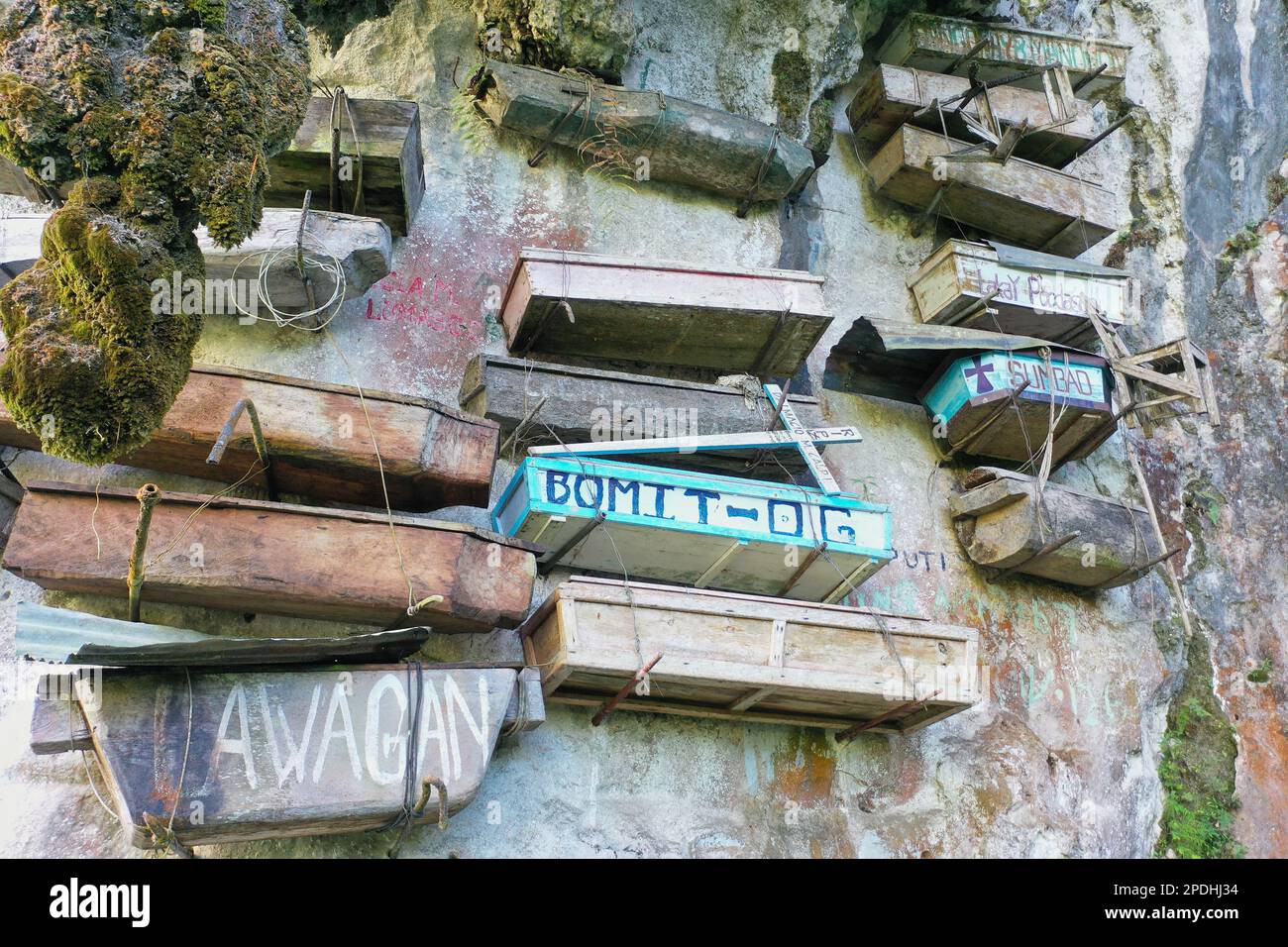 Close-up of the hanging coffins of Sagada on an imposing white rock ...