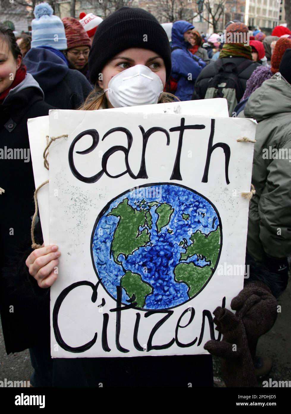 People carry signs during a protest against global warming in Montreal ...