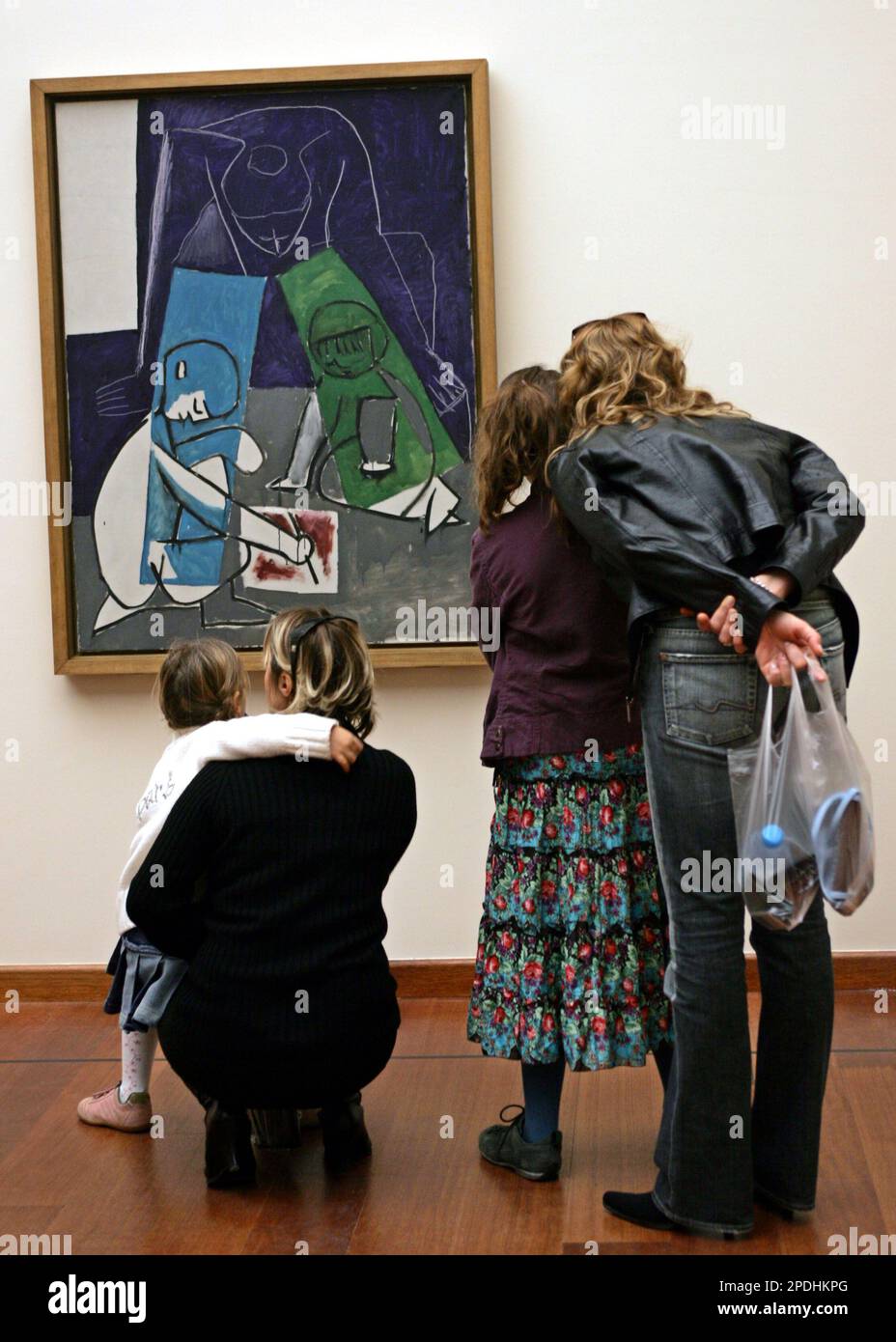 Visitors look at the "Woman and children" , a work by Picasso, at the ...
