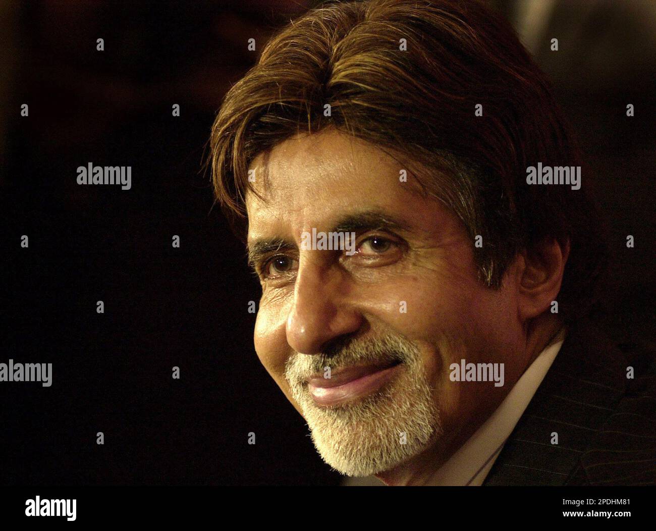 ** FILE ** Bollywood actor Amitabh Bachchan smiles after he was ...