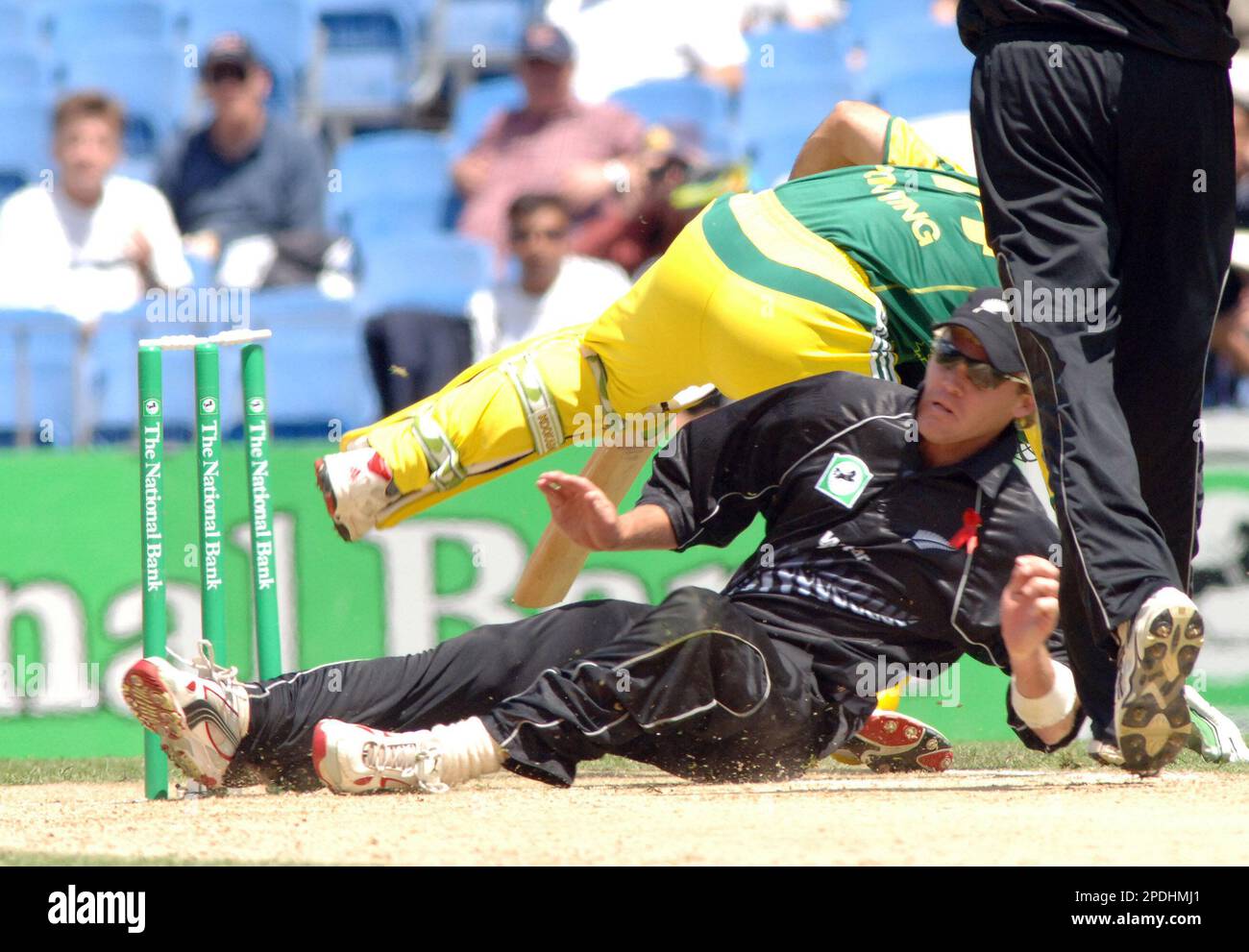 New Zealand's Lou Vincent, lower, collides with Australia's Ricky ...