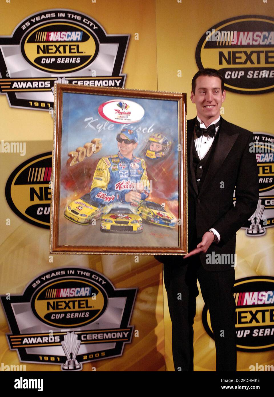 Kyle Busch poses backstage with his Rookie of the Year award at NASCAR ...
