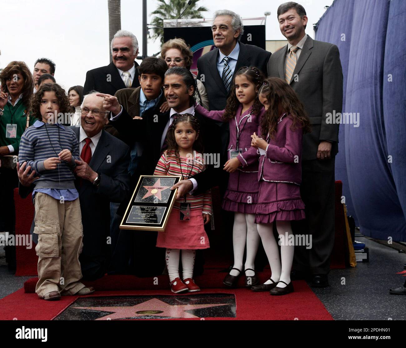 Mexican singer Alejandro Fernandez, kneeling center, and his children ...