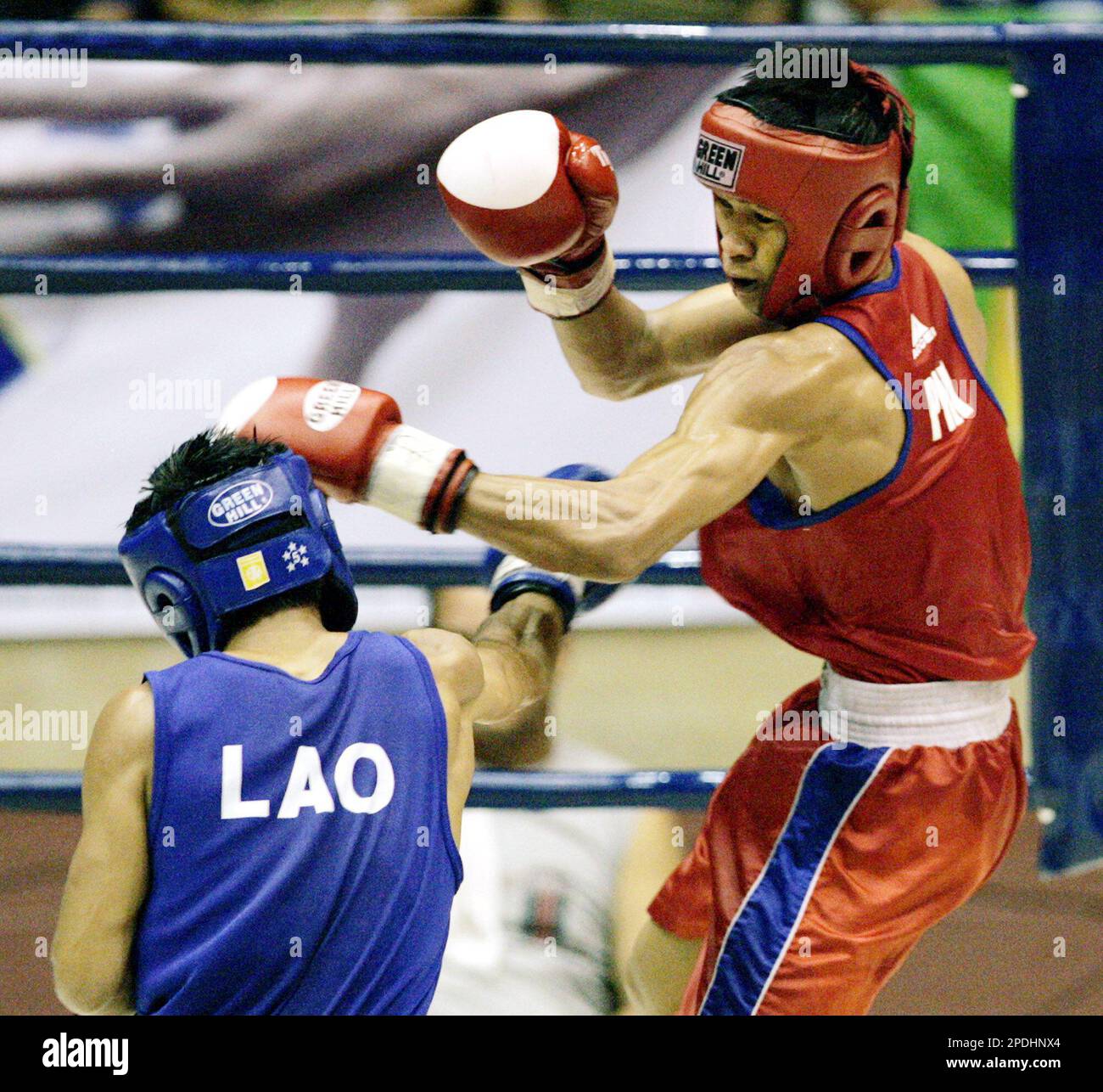 Philippines' Joan Tipon, red, strikes Laos' Sayyalak Chathasone during ...