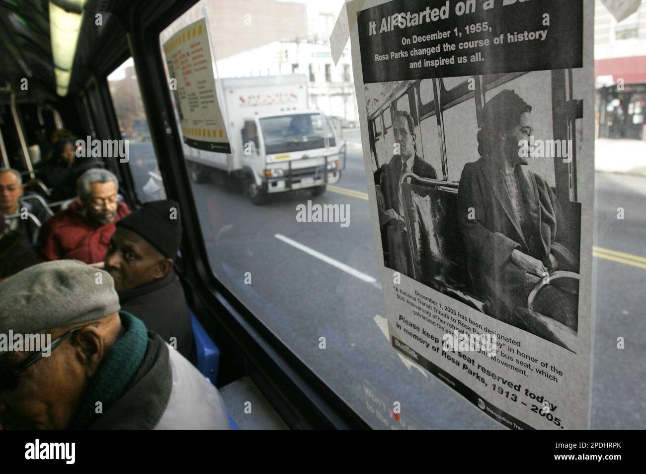 A poster entitled "It All Started On A Bus," is posted above the front ...