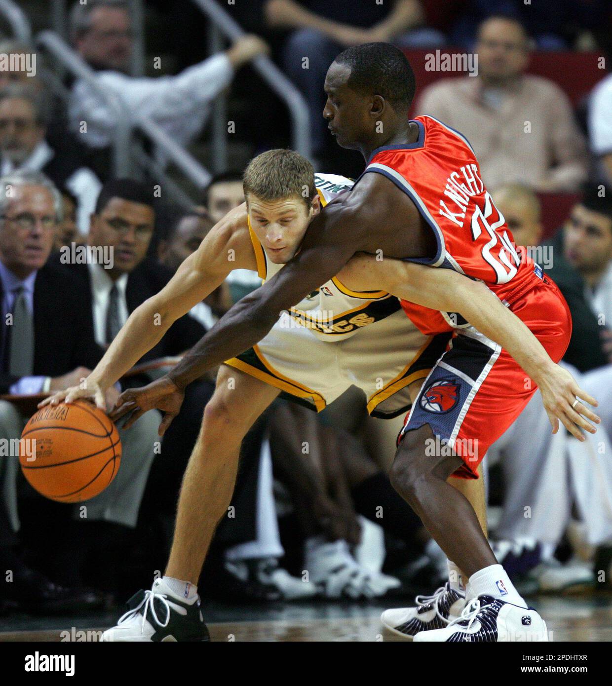 Charlotte Bobcats' Breven Knight, right, reaches across Seattle ...