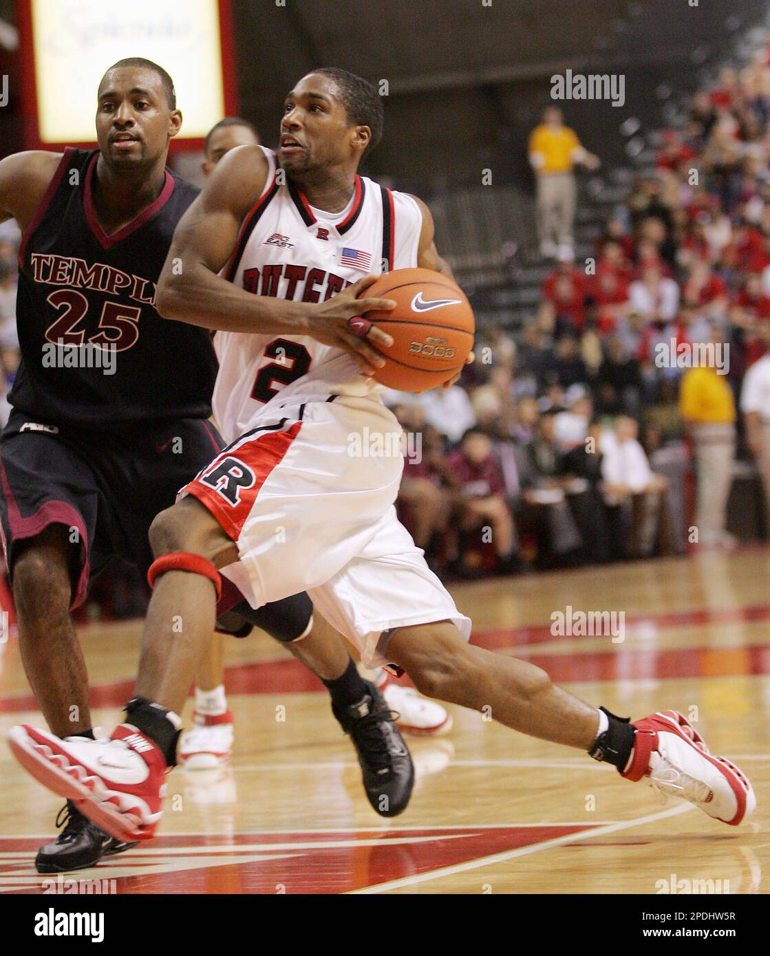 Rutgers' Anthony Farmer (2) drives past Temple's Mardy Collins (25 ...