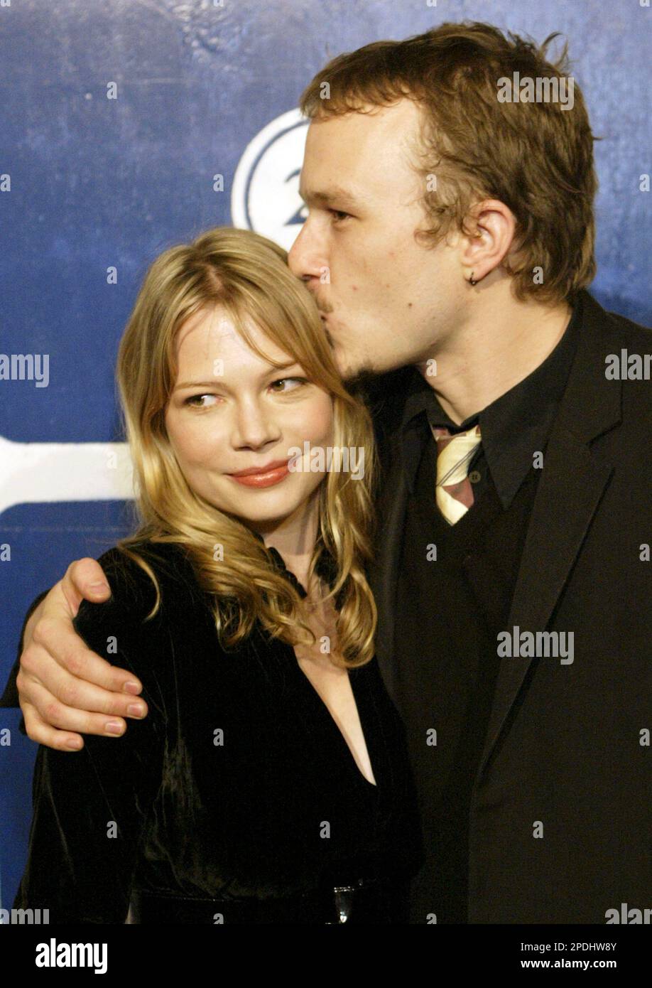 Australian actor Heath Ledger kisses girlfriend Michelle Williams ...