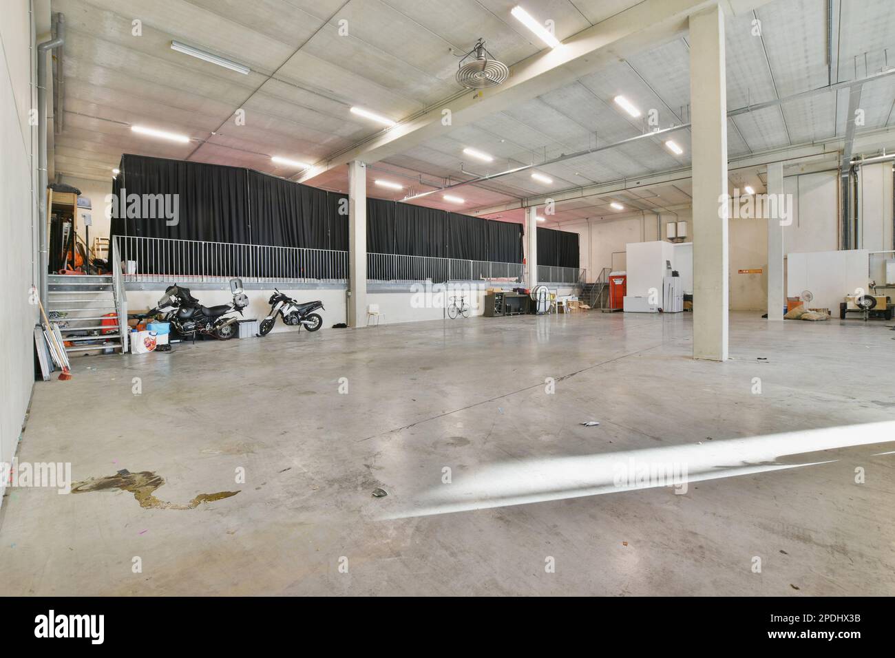 the inside of a building that is being used as a car showroom for ...