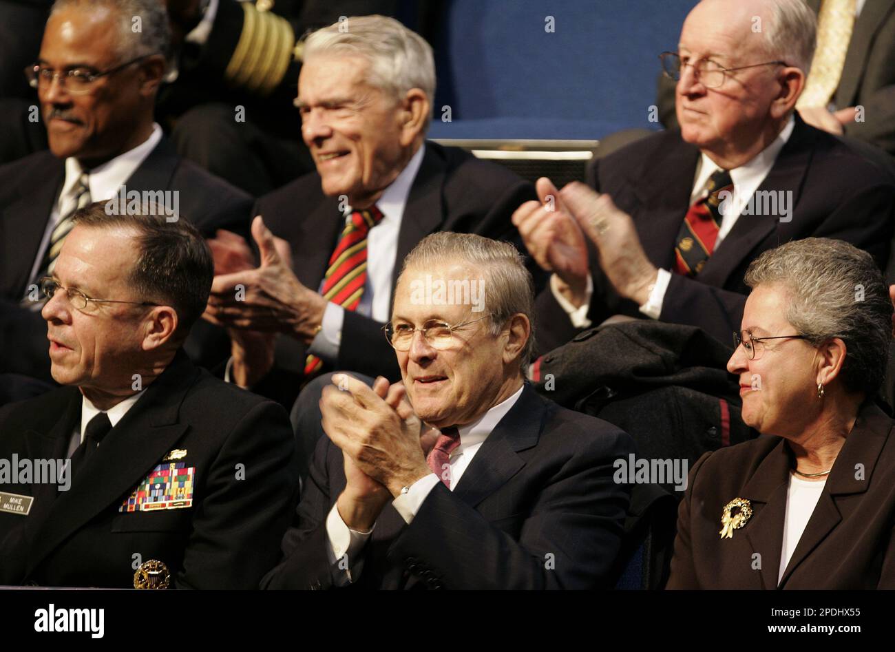 U.S. Defense Secretary Donald Rumsfeld, front row center, applauds as ...