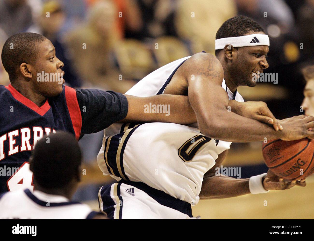 Pittsburgh's John DeGroat, right, reaches for a loose ball as St ...