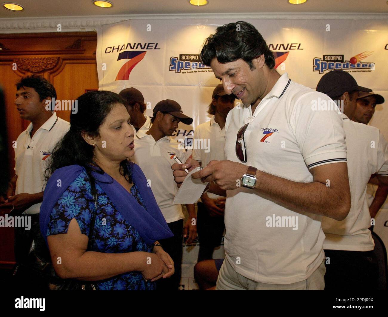 Former Pakistani cricket captain Wasim Akram signs autographs during an ...