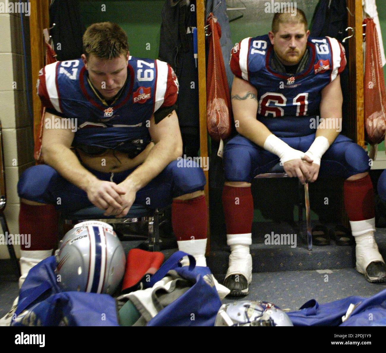 Montreal Alouettes Dave Mudge, left, and Luke Fritz sit in the dressing ...