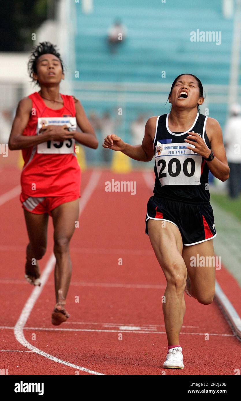 Mercedita Manipol, right from the Philippines crosses the finish line ...