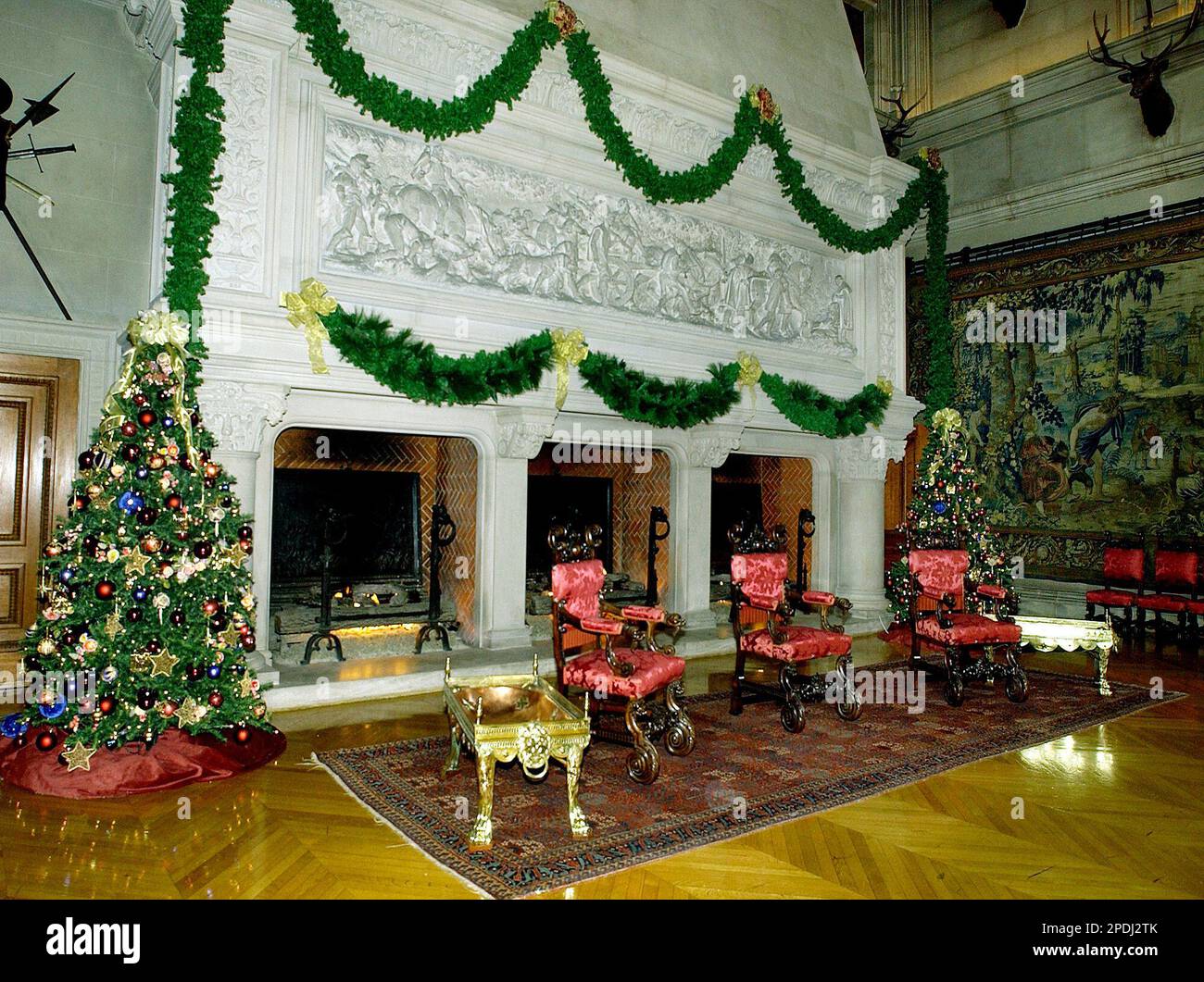 The dinning area fireplaces of the Bilmore House are shown decorated ...