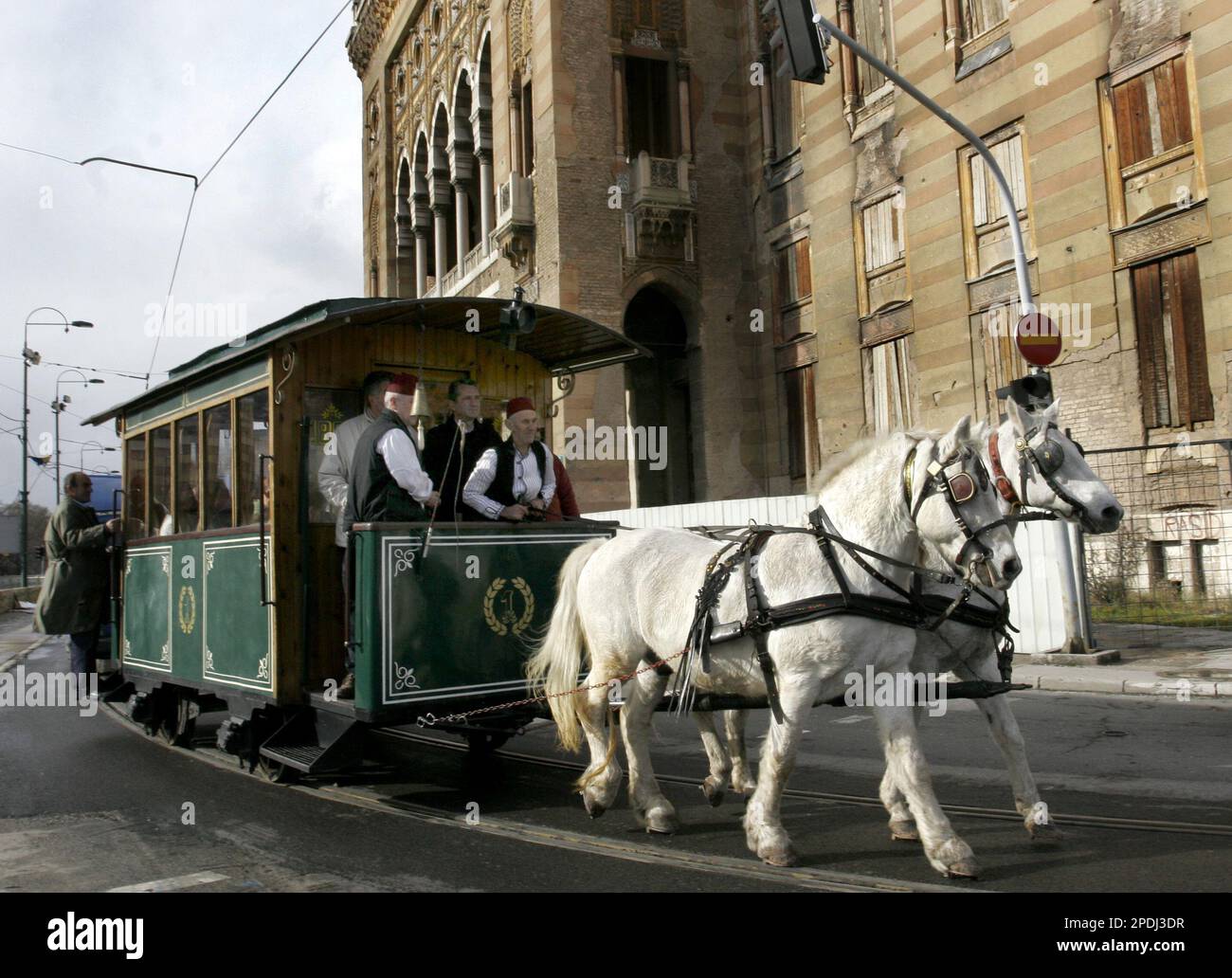 A horse drawn cab makes its way in Sarajevo, Sunday, Nov. 27, 2005 ...