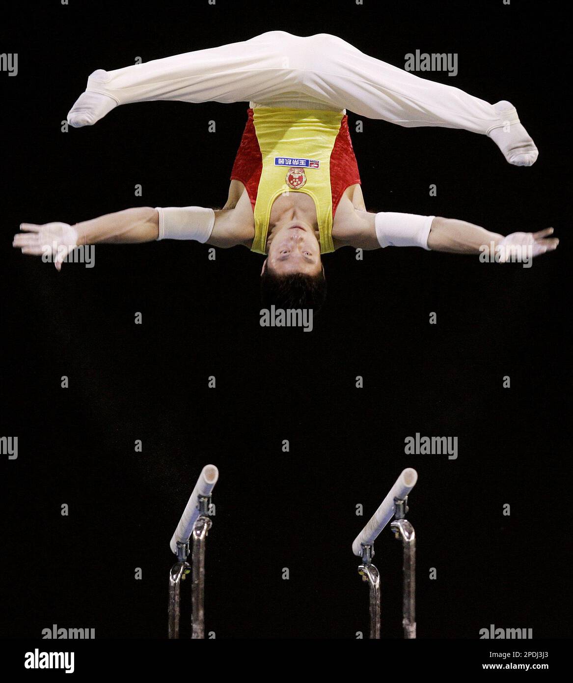 China's Li Xiaopeng performs his routine on the Parallel Bars at the ...