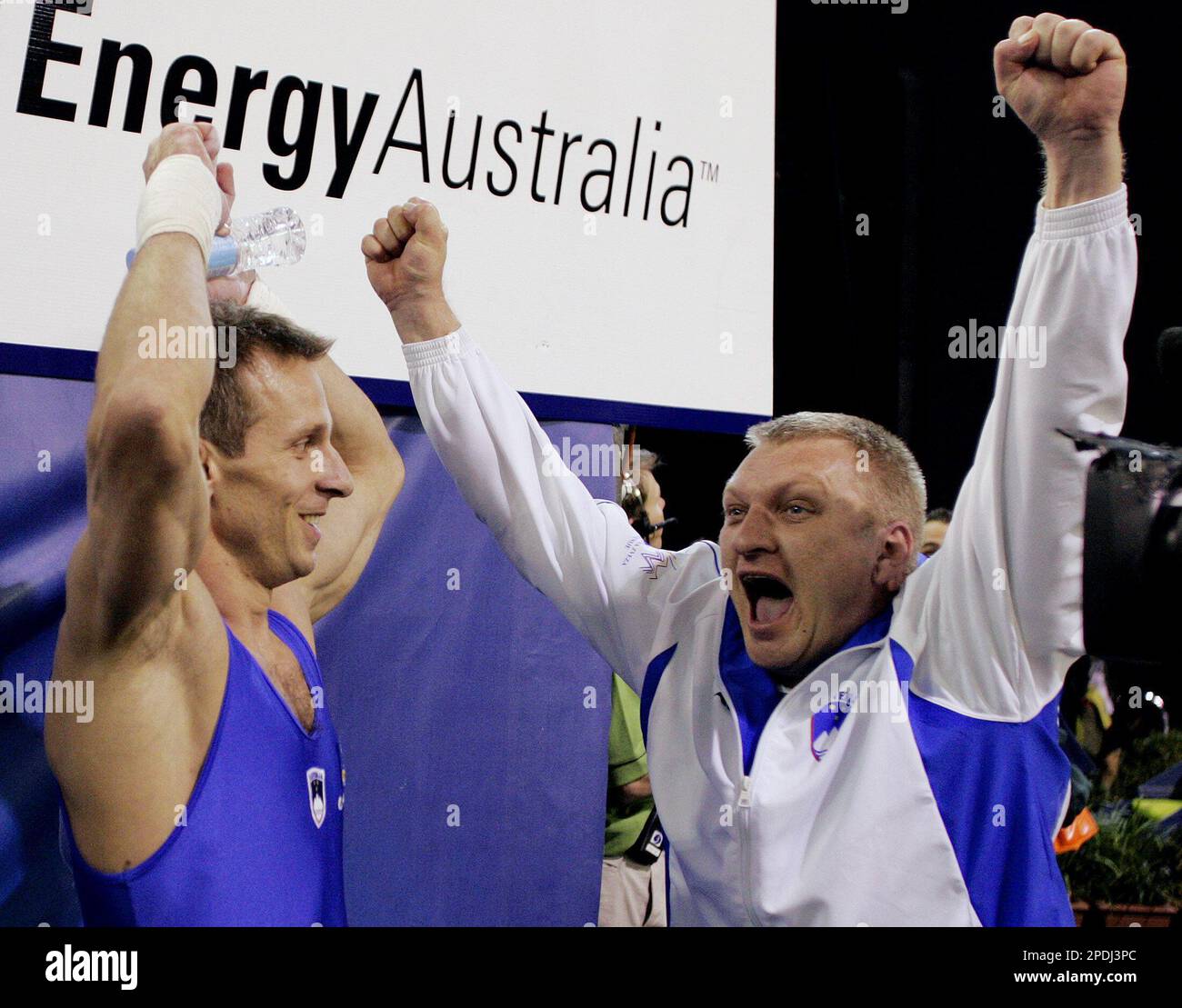Slovenia's Aijaz Pegan, left, reacts with team official Igor Fedoruk ...