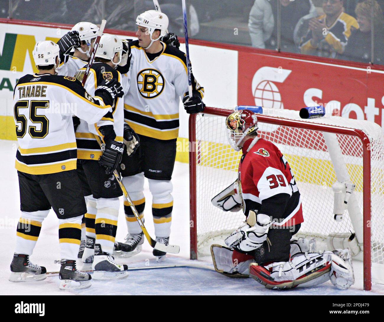 Boston Bruins celebrate teammate Brad Isbister's, center, goal against ...