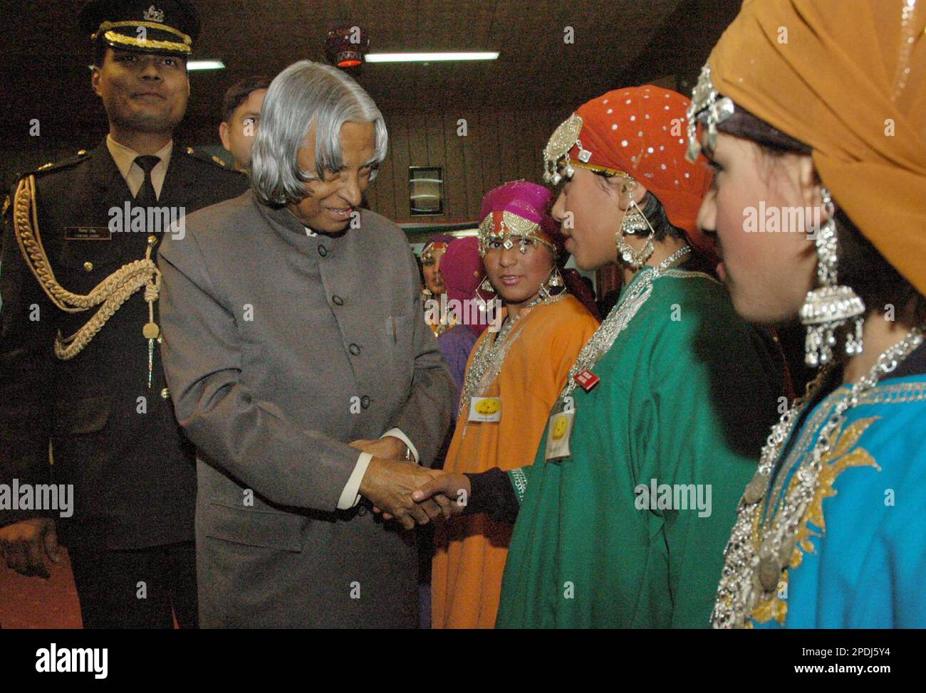 Indian President A.P.J. Abdul Kalam, center, shakes hands with orphan ...
