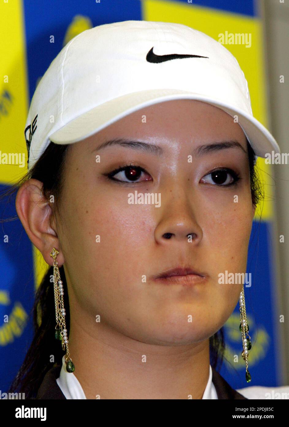 Michelle Wie reacts to reporters' questions during a press conference ...