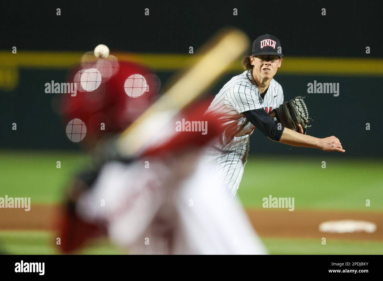 March 14, 2023: UNLV pitcher Reese Lueck #30 watches as his pitches reaches the batter. Arkansas ...
