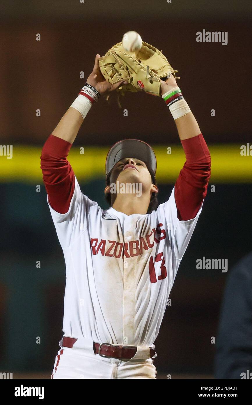March 14, 2023: Razorback infielder Jayson Jones #13 settles under a ...