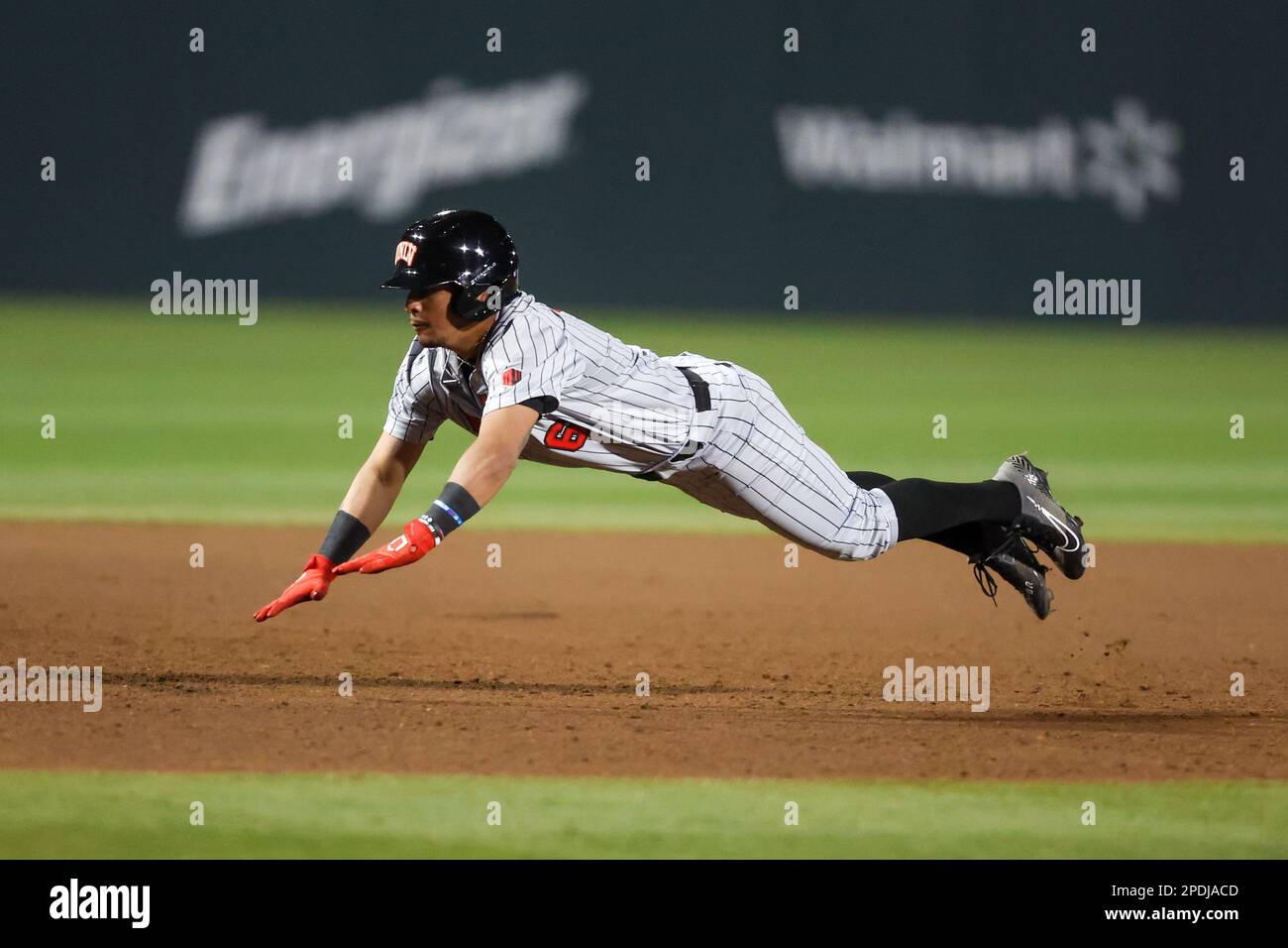 March 14, 2023: Noah Rodriguez #6 HustlinÕ Rebels base runner dives ...