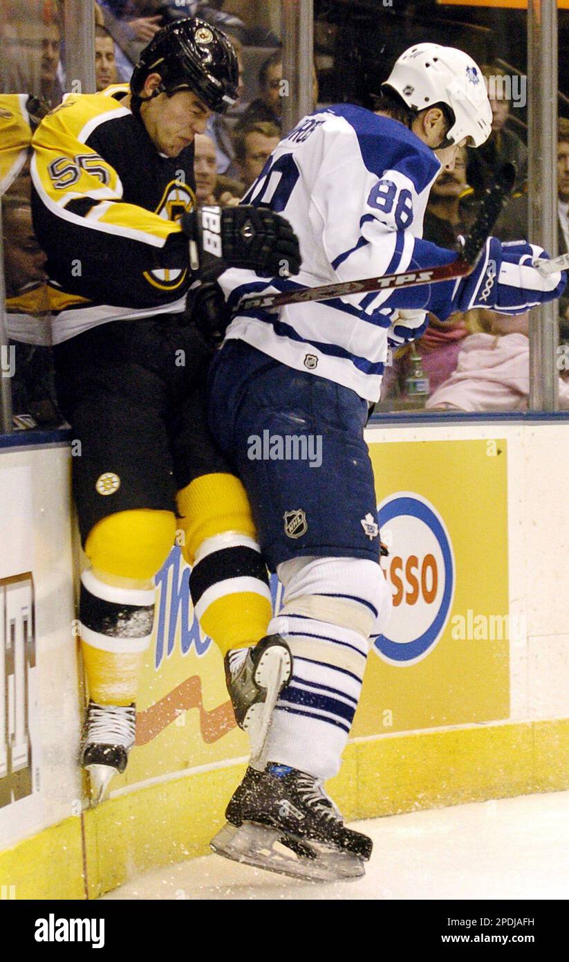 Toronto Maple Leafs Eric Lindros, right, hits Boston Bruins David ...
