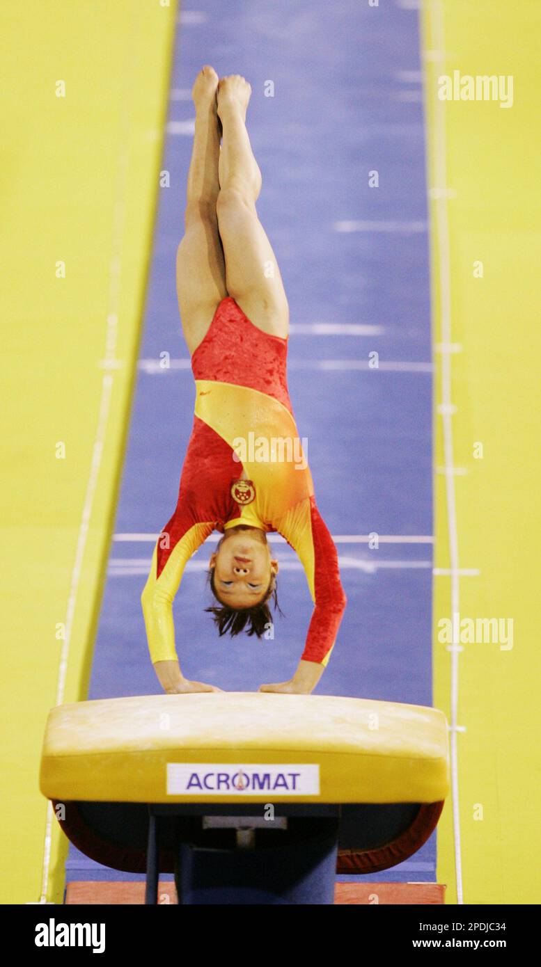 Cheng Fei of China makes a vault during women's qualifying at the World ...