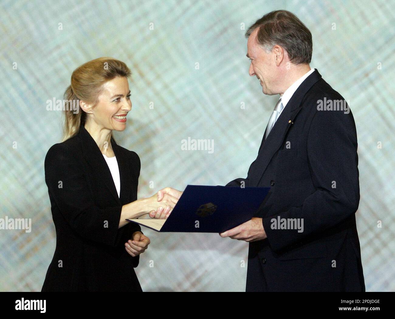 German President Horst Koehler, right, hands over the letter of ...