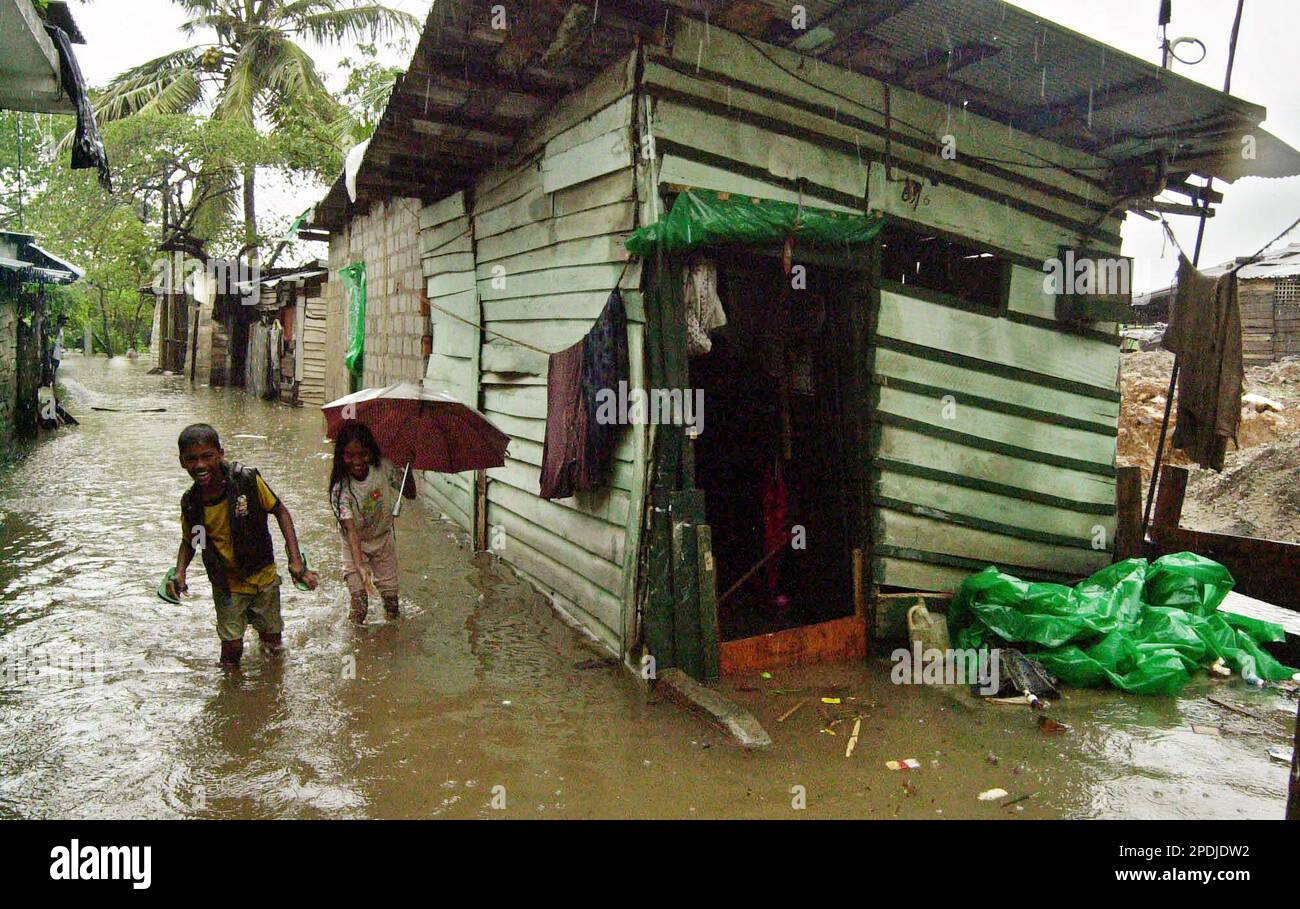 Sri Lankan children play in water following heavy rains in Colombo, Sri ...