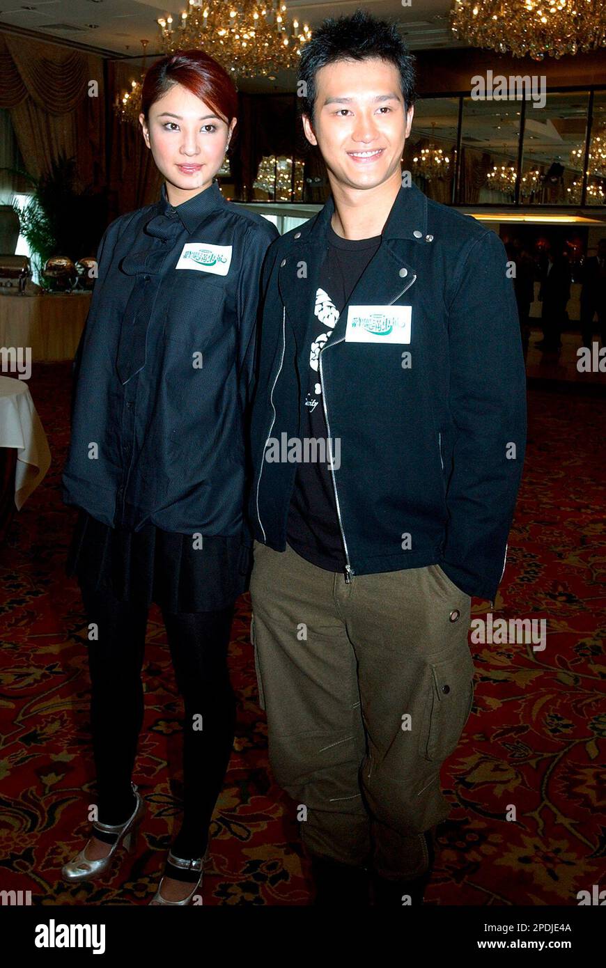 Hong Kong singers Dick Ng, right, poses with Yumiko Cheng during a news ...