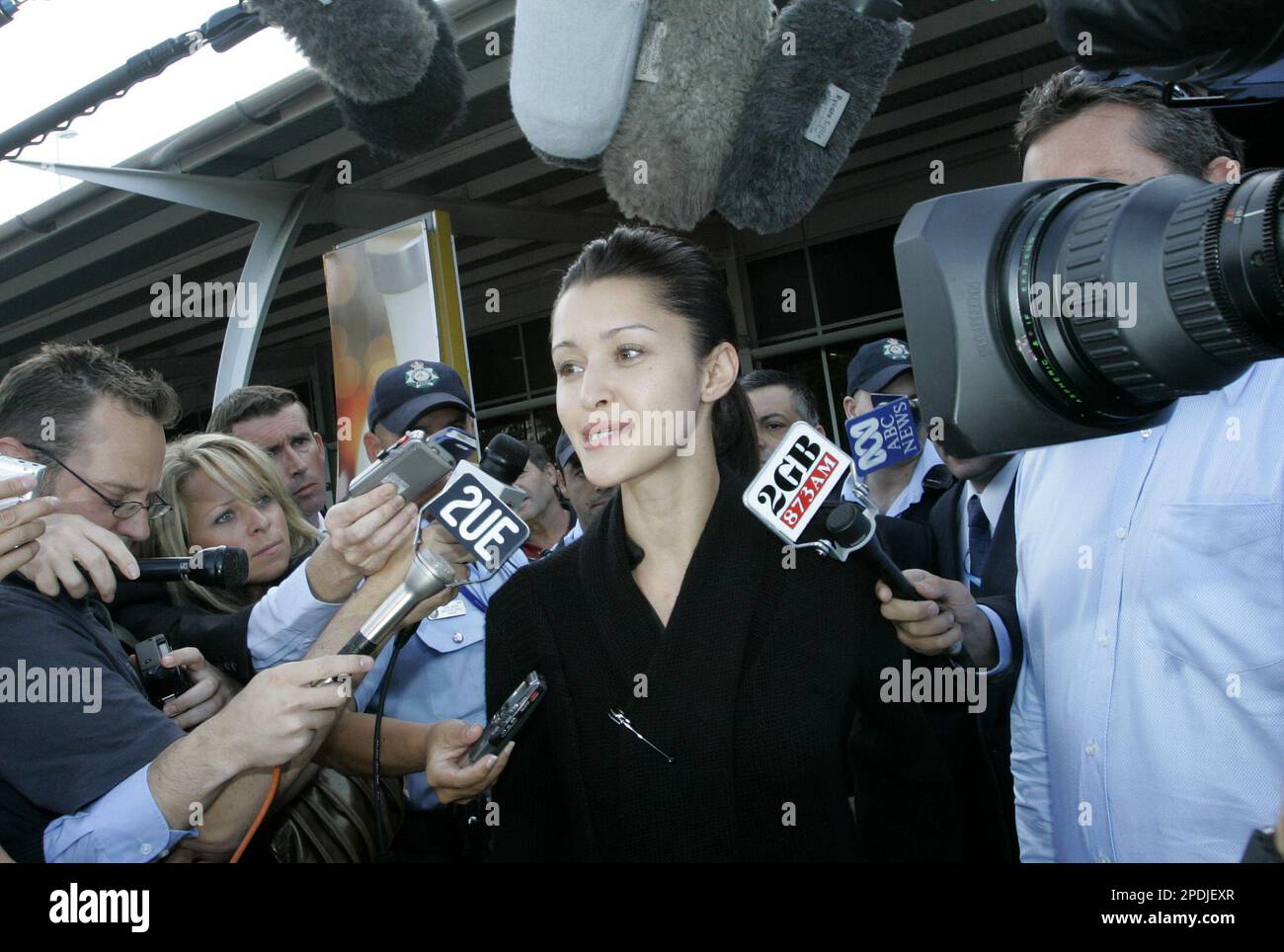 Michelle Leslie, center, the Australian model who was given a three ...