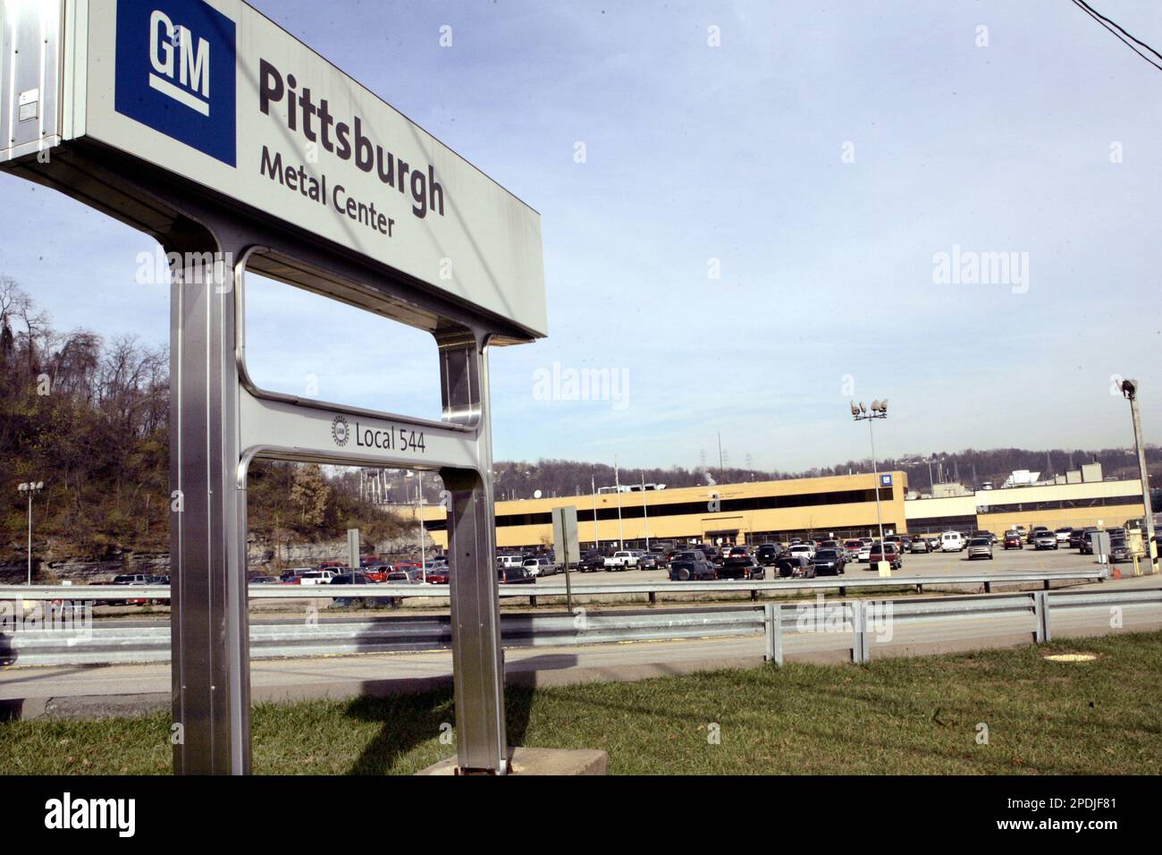 The sign for the General Motors Corp. metal center is seen in front of ...