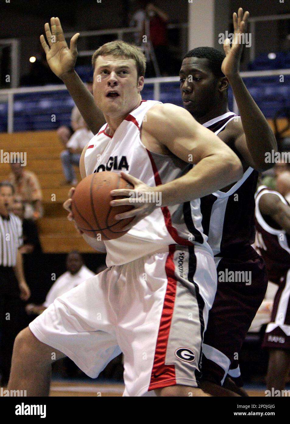 Georgia's Dave Bliss, foregorund, drives around Fordham's Bryant ...