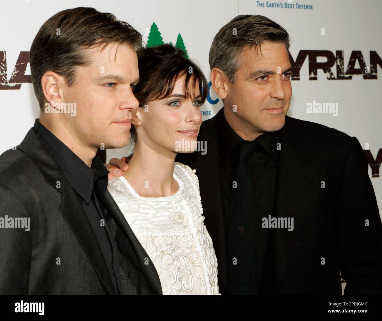 Matt Damon, left, Amanda Peet, center,and George Clooney pose for ...