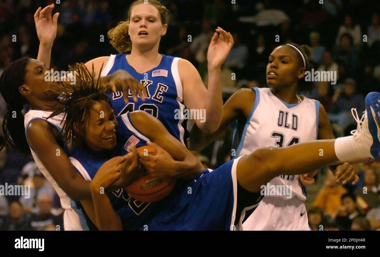 Duke's Monique Currie, front, is fouled by Old Dominion's Paula Muxiri ...