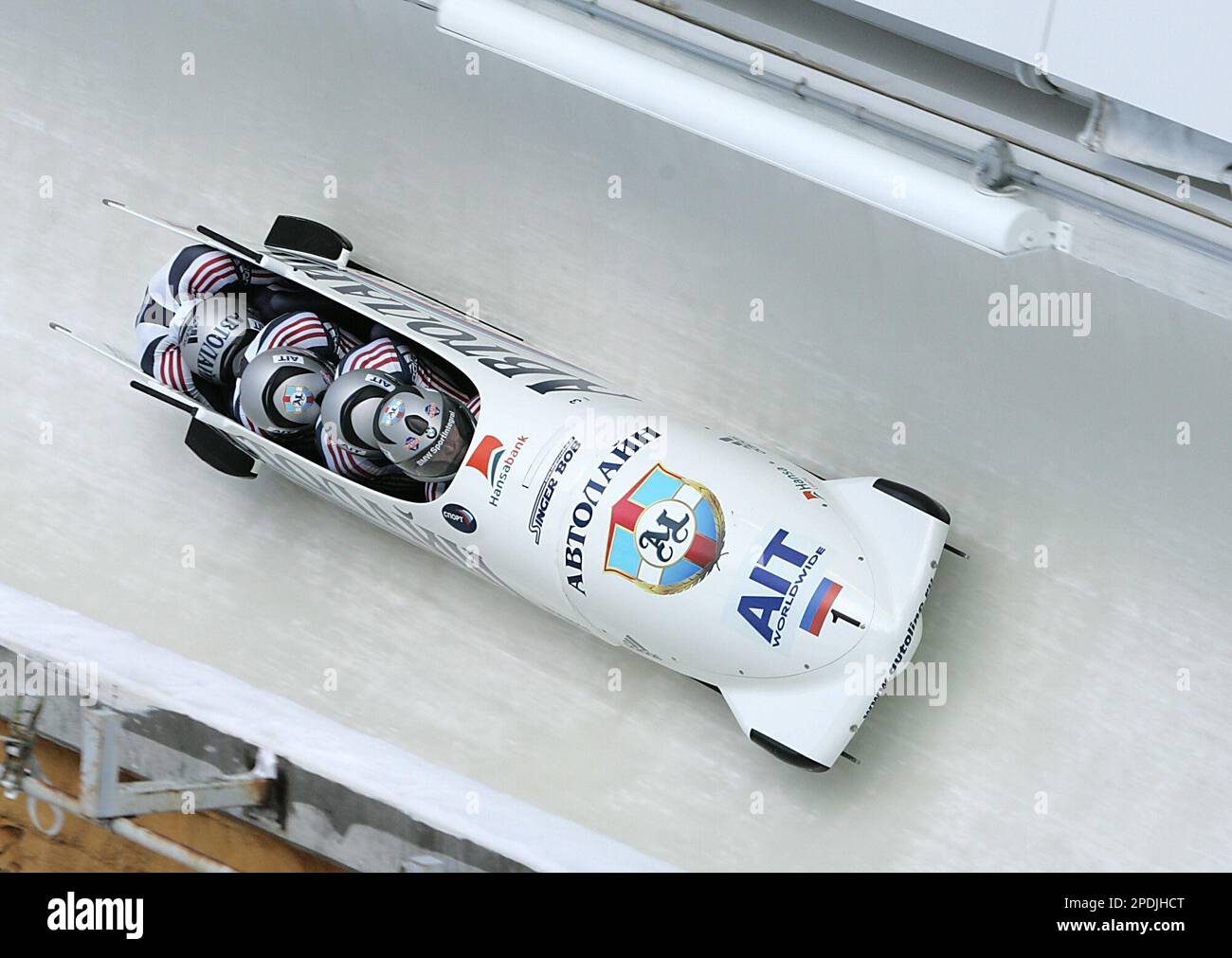 The Russia 1 bobsled piloted by Alexandr Zoubkov with side-pushers ...