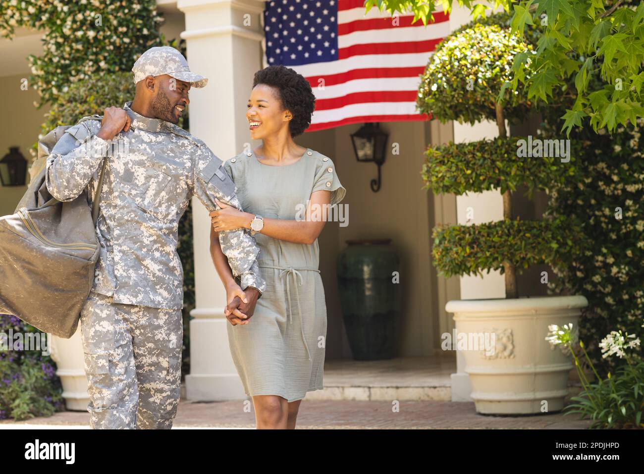 Happy african american soldier wearing military uniform and his wife ...