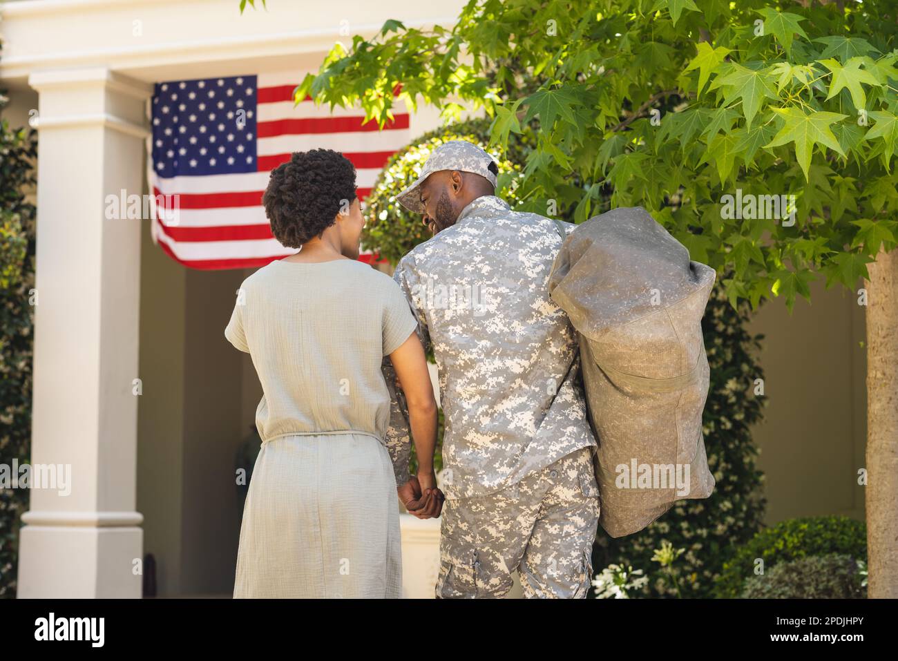 Happy african american soldier wearing military uniform and his wife ...