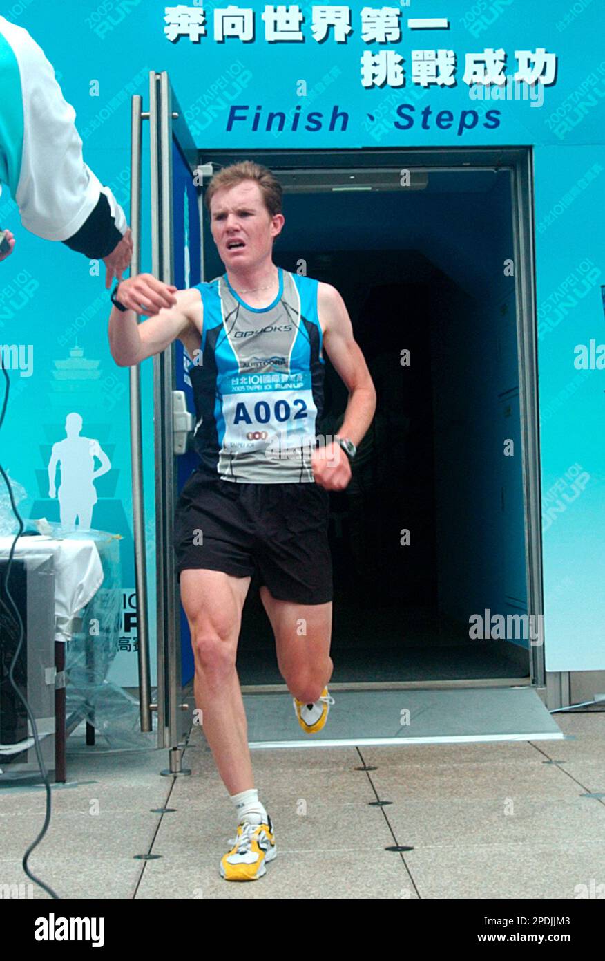 Australia's Paul Crake crosses the finish line at the 91st floor of the ...