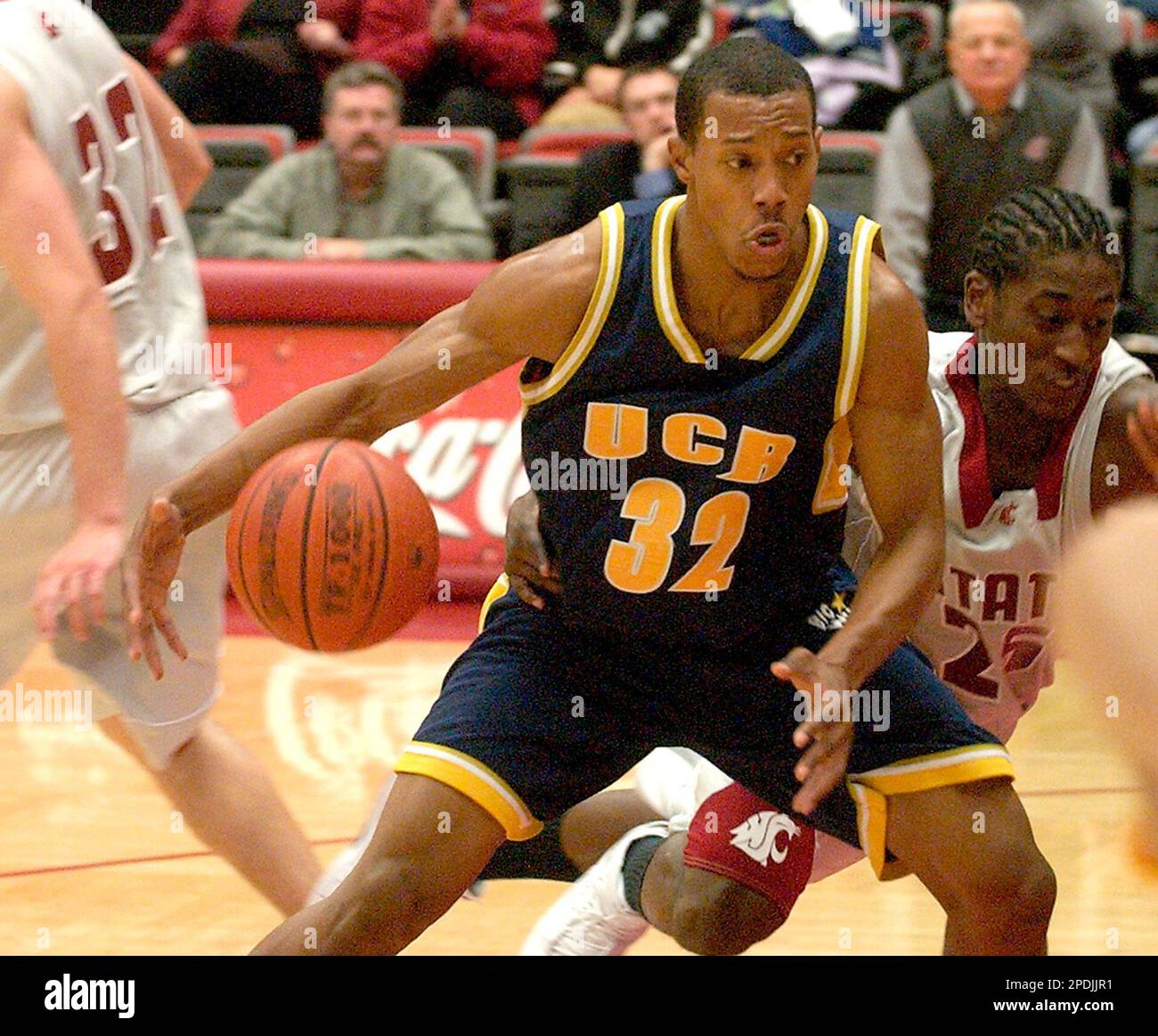 UC Riverside's Larry Cunningham, left, drives the lane with Washington ...