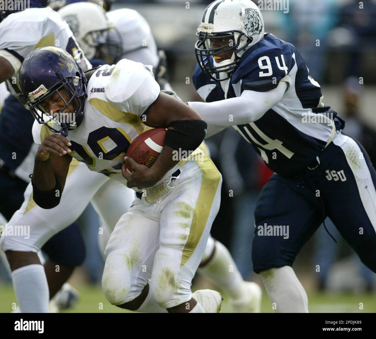 Alcorn State running back Jeremy McCoy, left, attempts to elude the ...