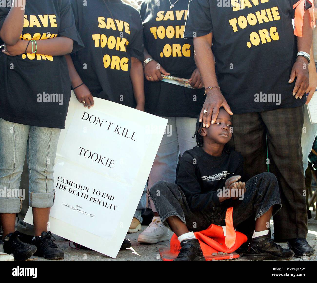 Deshawn Lee Thompson, 7, sitting, of Richmond Calif., joins a rally for ...