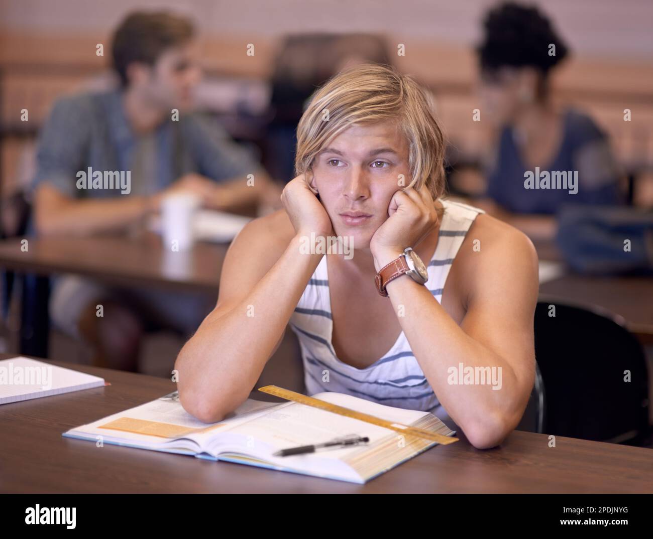 Hes not impressed with his course work...a bored-looking young college ...